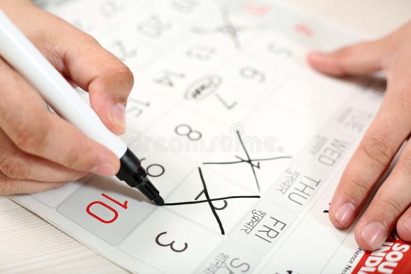 Picture of Hand is Marking Date on Calendar with Marker Stock Photo ...