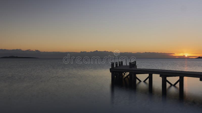 A Picture of Jetty at Sunrise Stock Photo - Image of back, loneliness ...