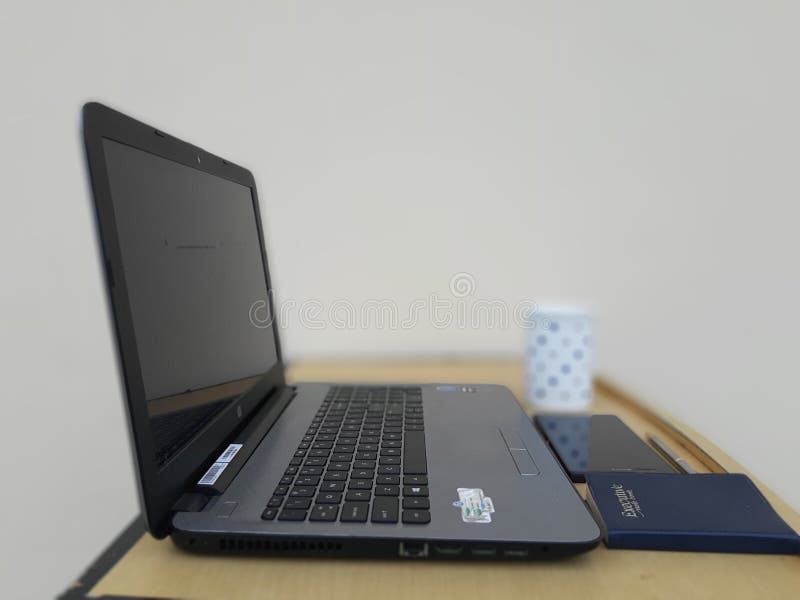 Picture of Laptop and Other Office Related Objects Kept on a Table ...