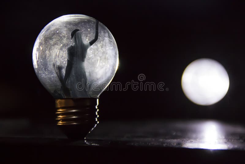 Lightbulb in Front of a Spotlight Stock Image - Image of technology ...