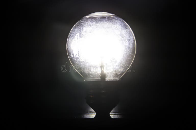 Lightbulb in Front of a Spotlight Stock Image - Image of technology ...