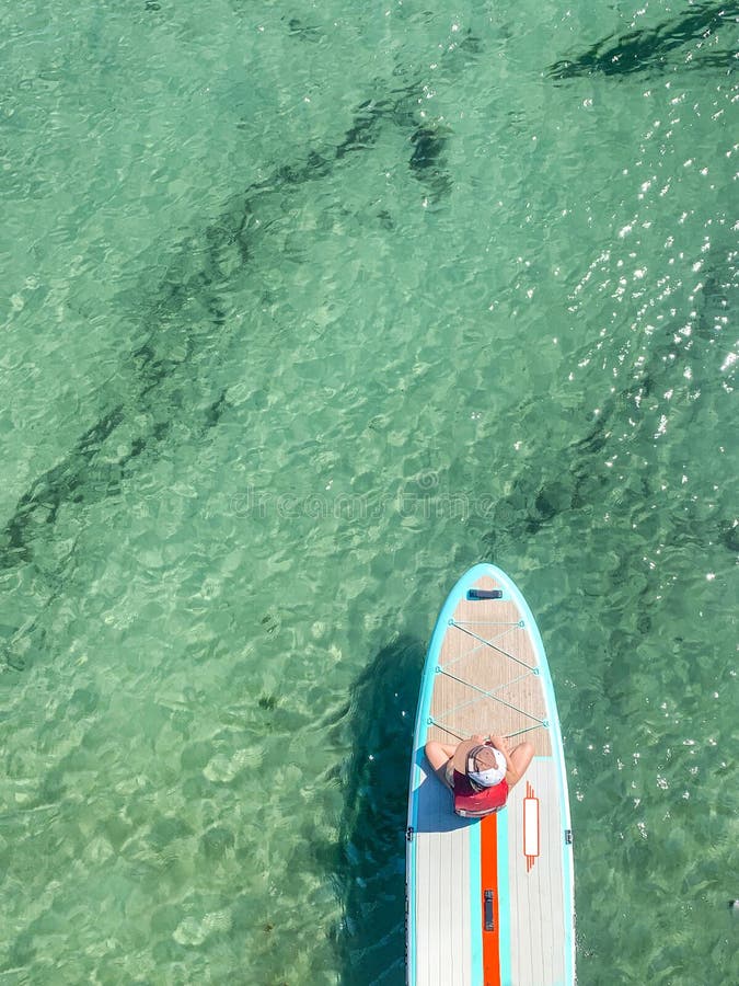 Little Girl on the Front of a Paddle Board Over the Ocean Stock Photo ...