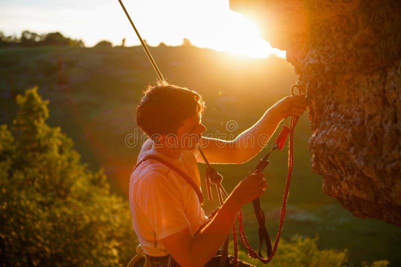 Picture of Man Clambering Over Rock. Stock Image - Image of plants ...