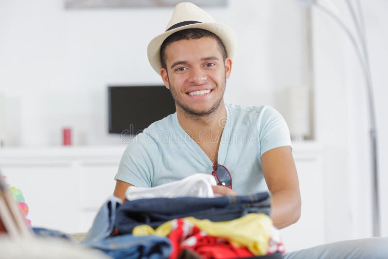 Picture man doing packing stock image. Image of suitcase - 152075857