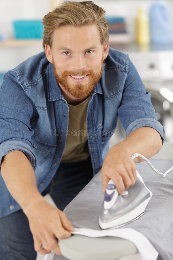 Picture of man ironing stock photo. Image of busy, hardworking - 259683208