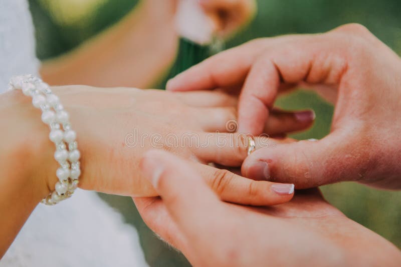 Picture of Man Putting Wedding Ring on Woman Hand Stock Photo - Image ...