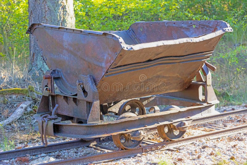 Picture of an Old, Dented and Rusty Wagon on an Old Track in the Forest ...