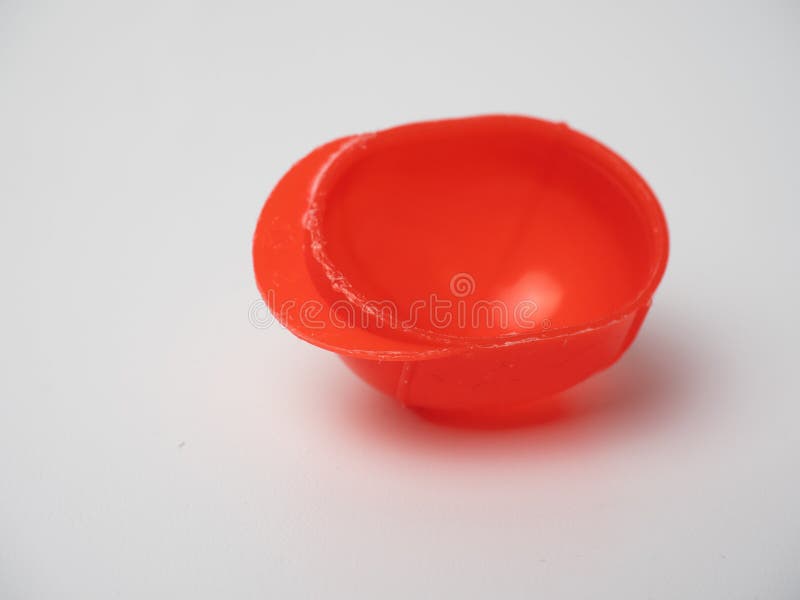 Picture of an Orange Plastic Cap Miniature Stock Photo - Image of ...