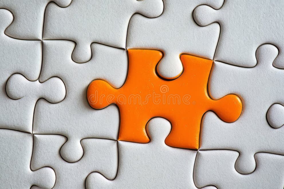 Picture of an Orange Puzzle Piece that Fits into a White Puzzle ...