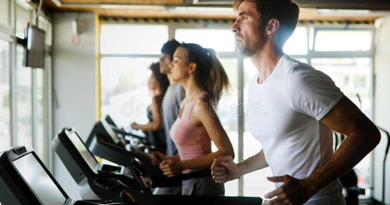 Picture of People Running on Treadmill in Gym Stock Photo - Image of ...
