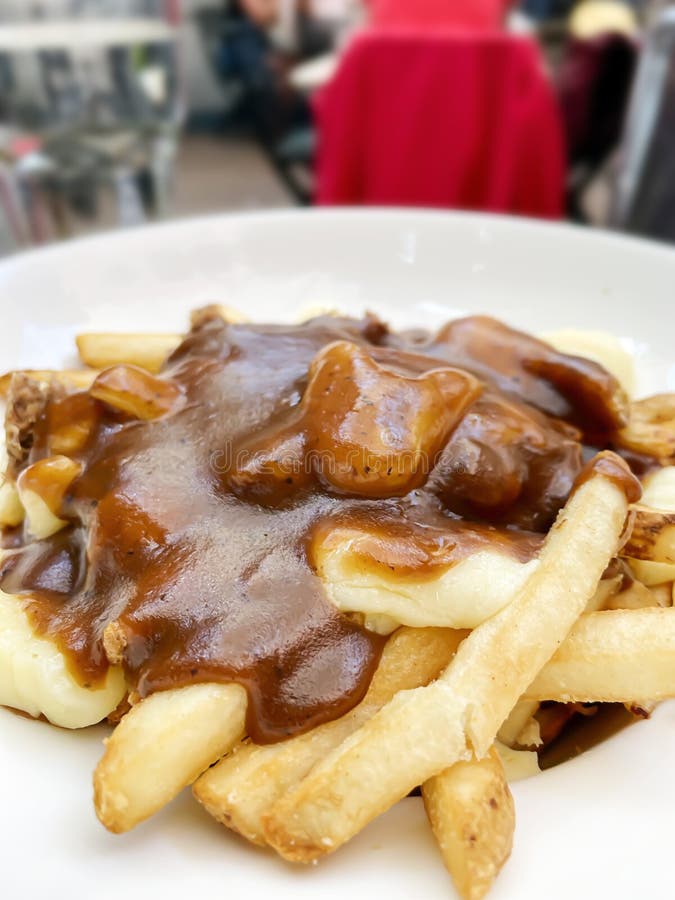 Poutine with Gravy and Cheese at a Restaurant Stock Image - Image of ...