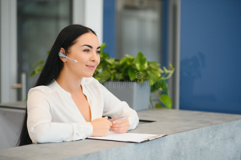 Picture of Pretty Receptionist at Work. Stock Photo - Image of office ...