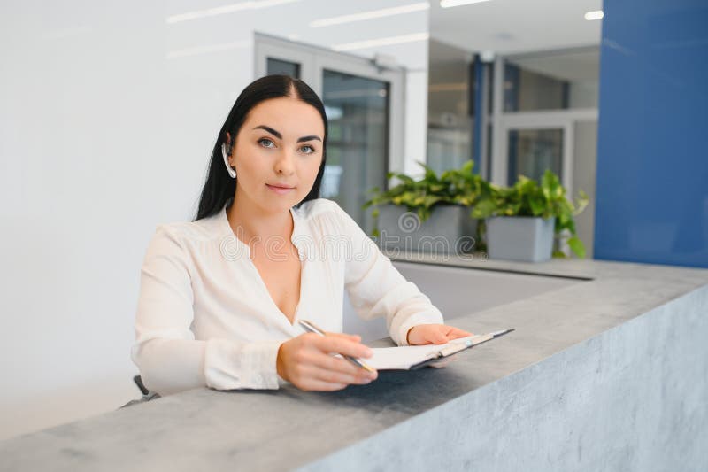 Picture of Pretty Receptionist at Work. Stock Image - Image of ...