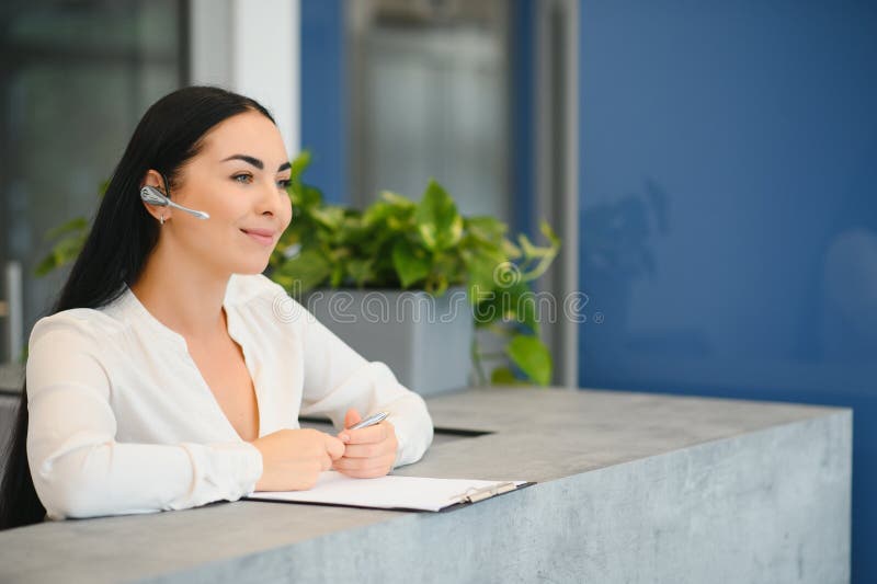 Picture of Pretty Receptionist at Work. Stock Image - Image of business ...