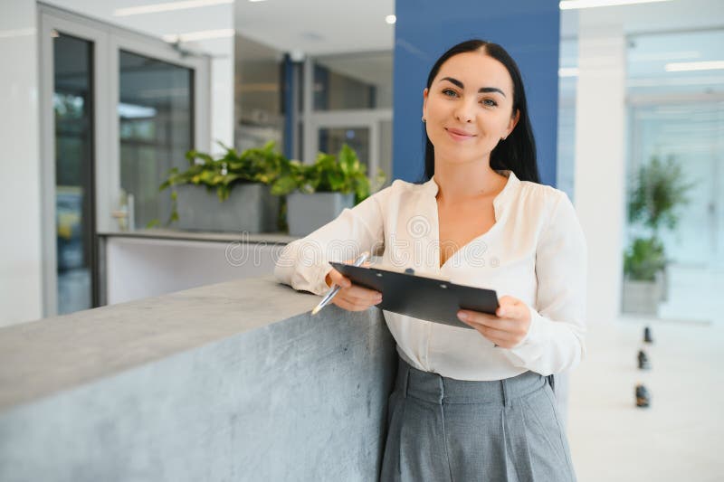 Picture of Pretty Receptionist at Work. Stock Image - Image of ...