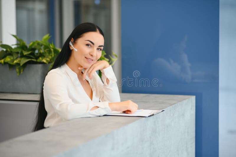 Picture of Pretty Receptionist at Work. Stock Photo - Image of employee ...