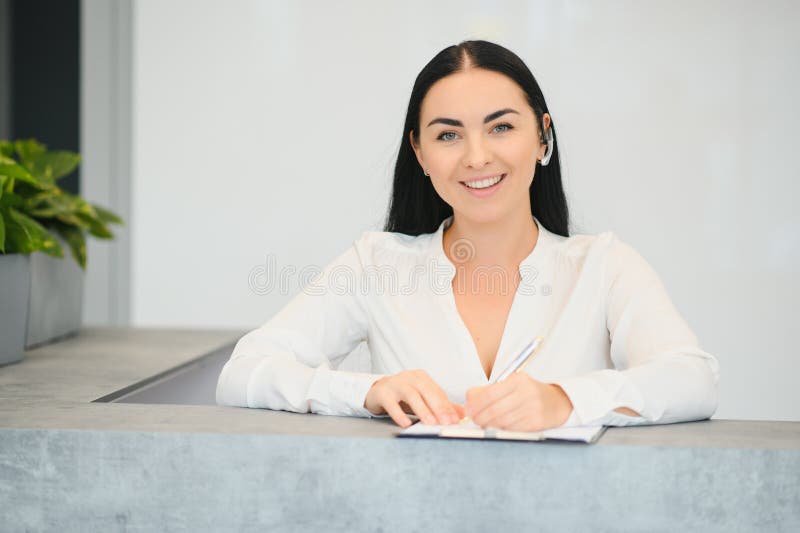 Picture of Pretty Receptionist at Work. Stock Photo - Image of manager ...