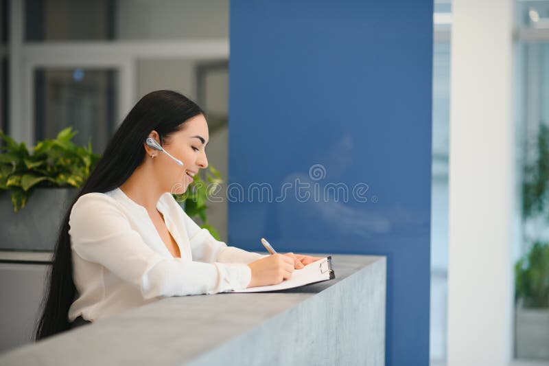 Picture of Pretty Receptionist at Work. Stock Image - Image of ...