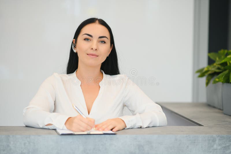 Picture of Pretty Receptionist at Work. Stock Image - Image of ...