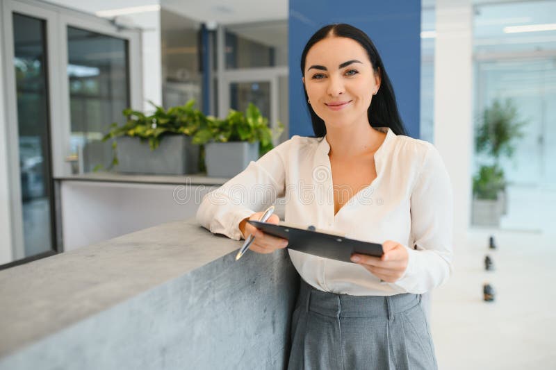Picture of Pretty Receptionist at Work. Stock Photo - Image of girl ...