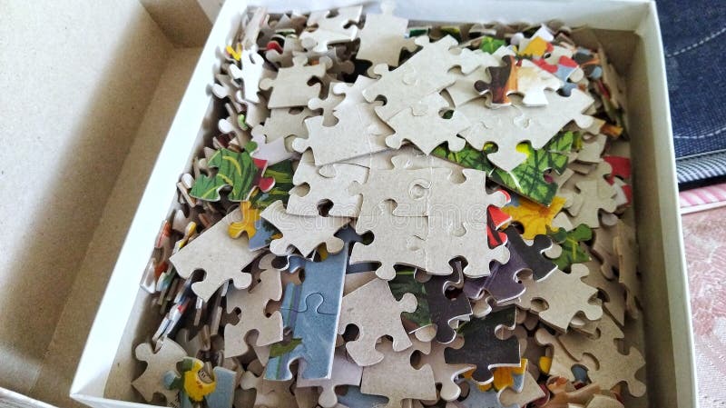 A Picture of Puzzle Pieces in Box Stock Image - Image of cardbox, hard ...