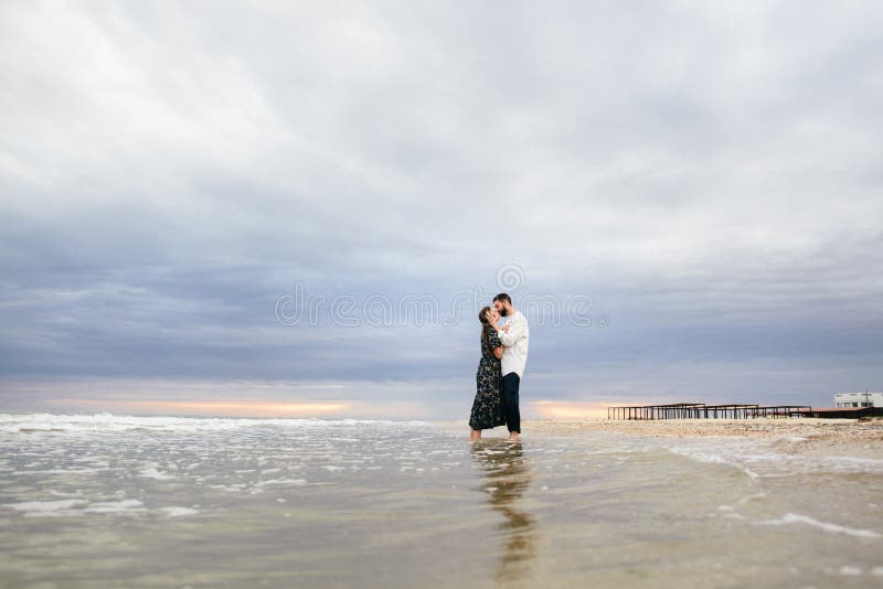 Picture of Romantic Young Couple on the Sea Shore Stock Photo - Image ...
