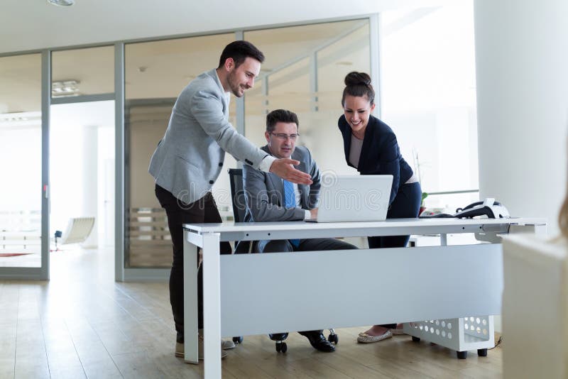 Picture of Sales Agents Working Together in Office Stock Photo - Image ...
