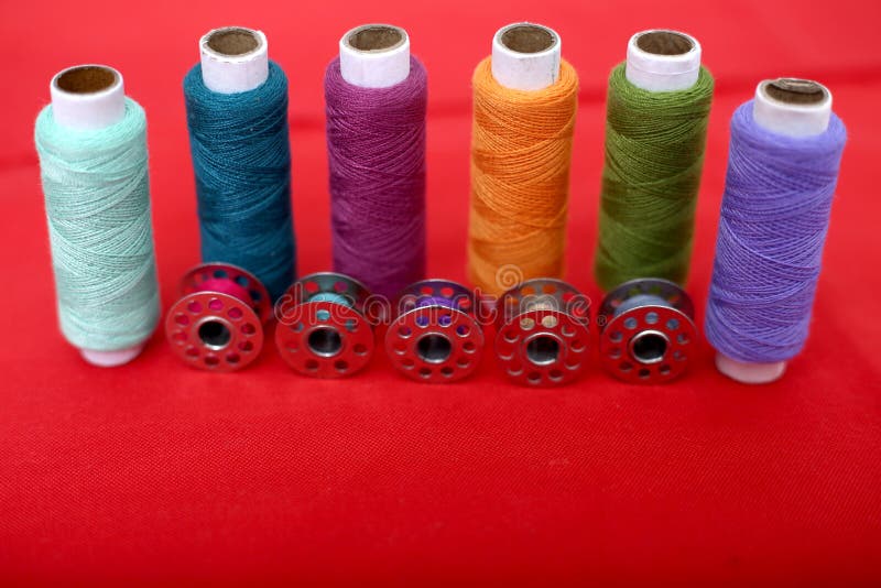 Picture of Sewing Thread and Bobbin on the Red Cloth Stock Photo ...