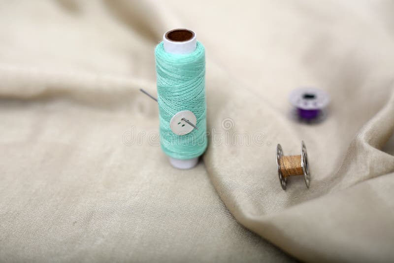 Picture of Sewing Thread, Button and Two Bobbin on the Cloth Stock ...