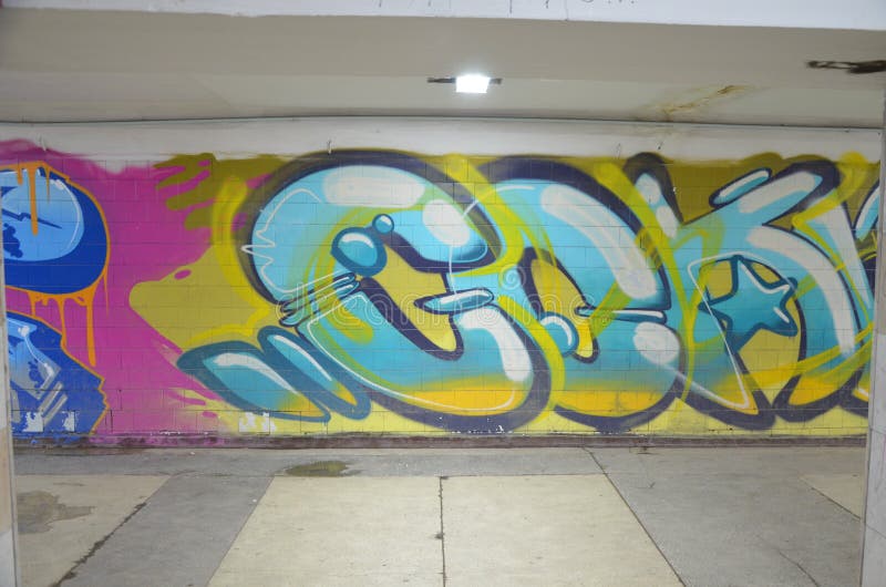 A Graffiti with Light-blue Letters on a Wall Editorial Stock Photo ...