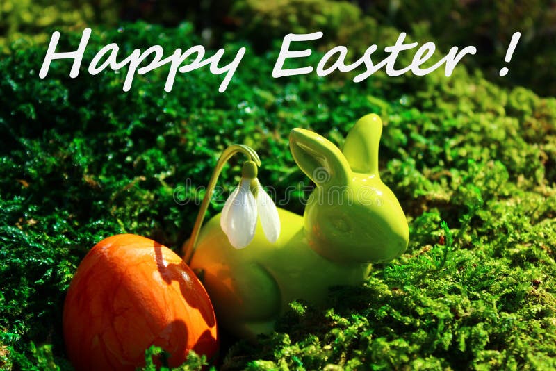 Happy Easter Greetings with an Easter Egg and a Bunny in the Moss Stock ...