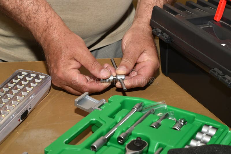 The Man Connects the Key and the Socket of the Key. Stock Photo - Image ...