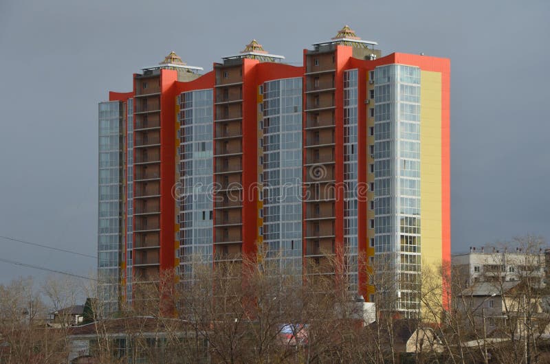 An orange modern building stock photo. Image of frond - 130015802