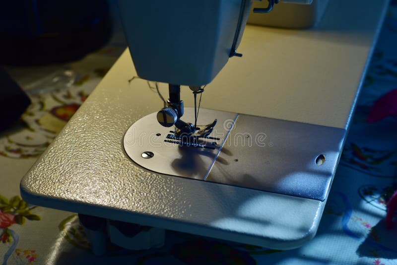 Close-up of a Section of a Sewing Machine with a Foot, a Needle and a ...