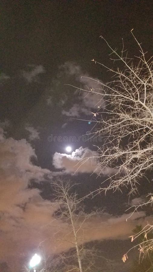 Moon Up High stock image. Image of moon, clouds, high - 135141829