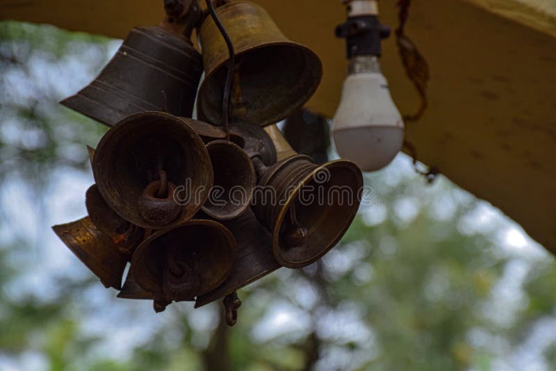 Picture of Small Copper Bells Hanging in the Hindu Temple Stock Photo ...