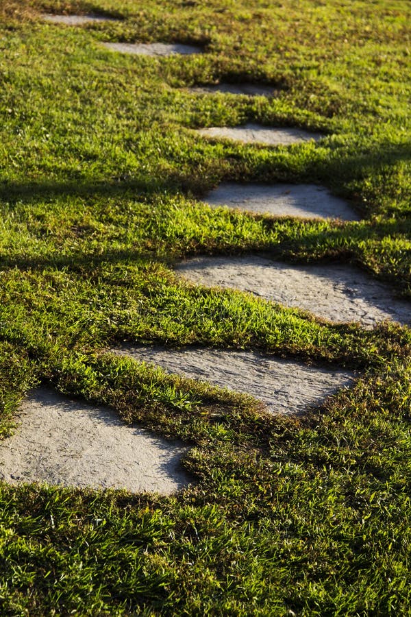 Stone path through grass stock image. Image of green - 104433189