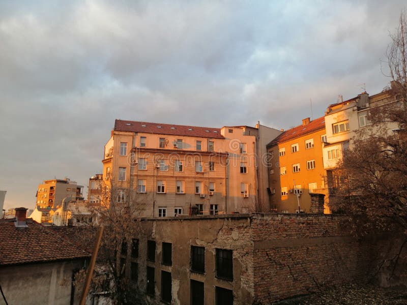 Sunny building stock photo. Image of cloud, sunset, building - 138162204