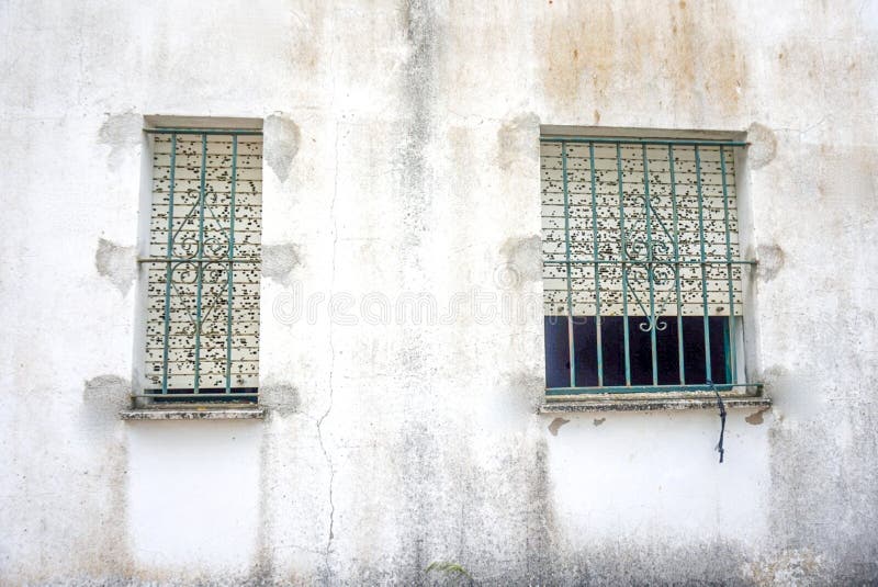 Picture of Two Windows with Bars of an Old Building Stock Photo - Image ...
