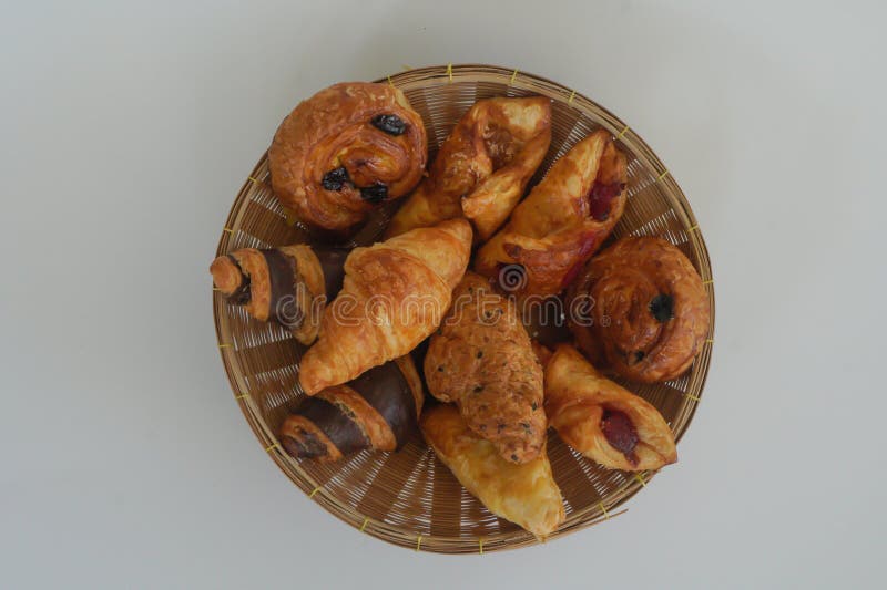 Picture Various Types of Bakery Breads are in a Basket on a White ...
