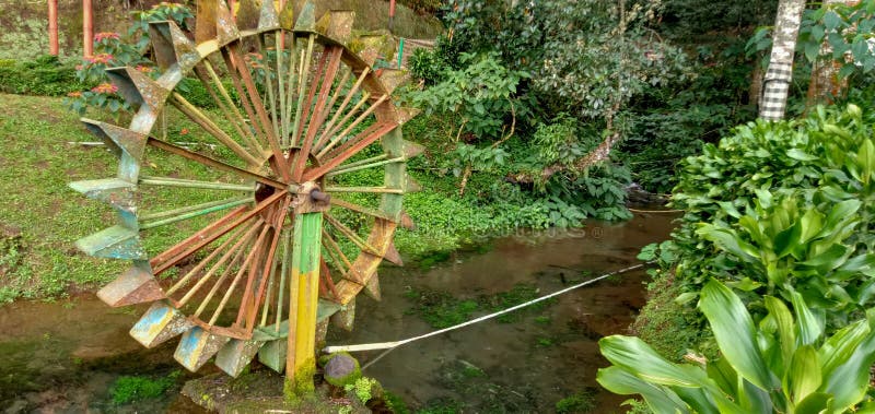 A Picture of a Waterwheel on a River Stock Photo - Image of sungai ...