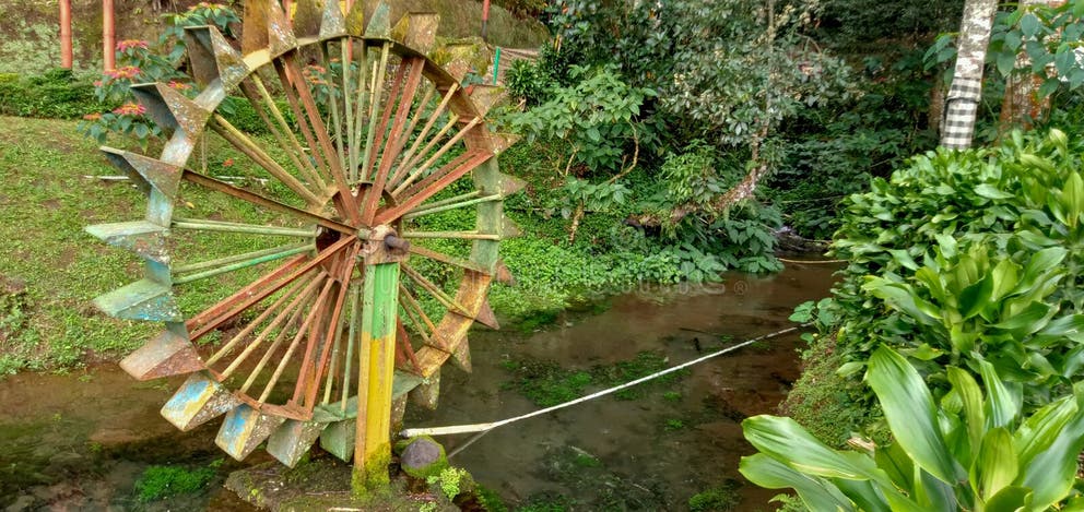 A Picture of a Waterwheel on a River Stock Photo - Image of sungai ...