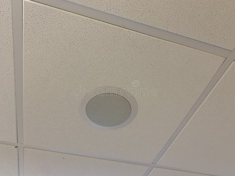 Picture of a White Ceiling Speaker with White Ceiling Tiles Stock Image ...