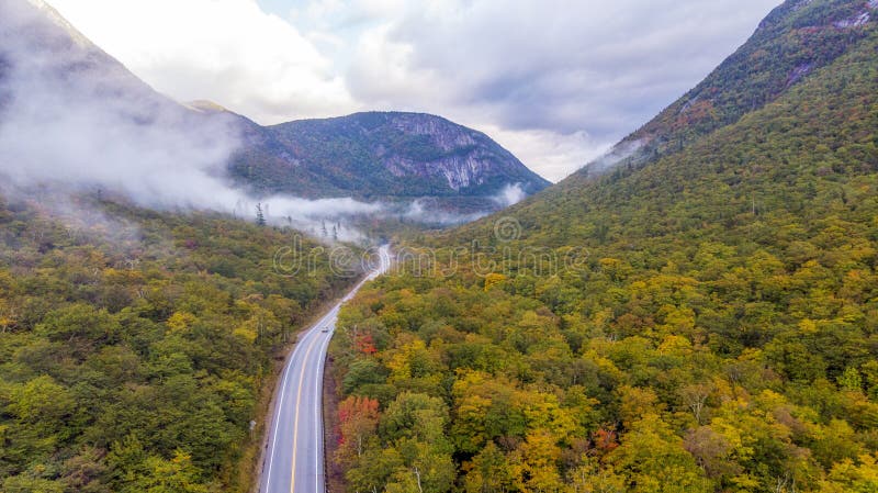 Windy Road Going through the Forest between Mountains in the Fall Stock ...