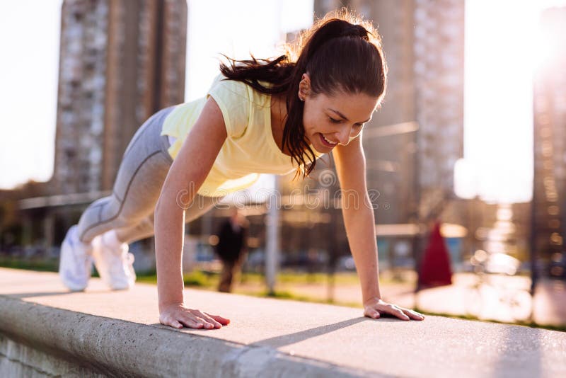 Picture of Woman Doing Push Ups in Urban Area Stock Photo - Image of ...