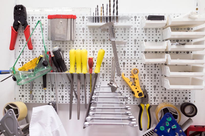 Picture of Working Tools Hanging on Wall Stock Photo - Image of metal ...