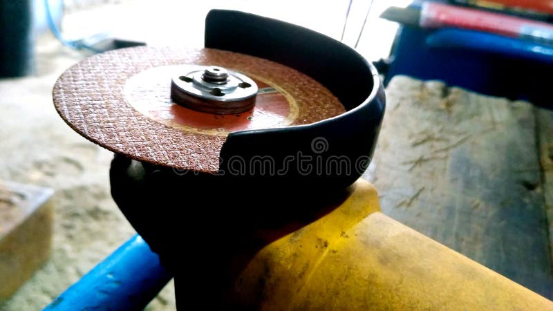 Picture of a Yellow Angle Grinder on a Wooden Background Stock Photo ...