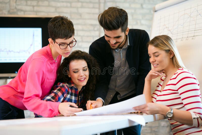Picture of Young Architects Discussing in Office Stock Image - Image of ...