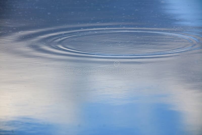 Blue Sky Reflected on the Surface of the Water with the Ripple Stock ...