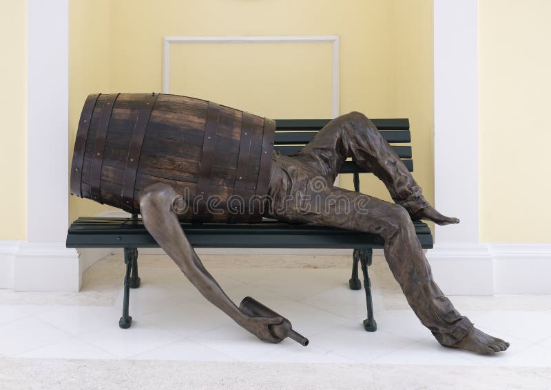 Bronze Sculpture with a Drunk Barefooted Man Lying on a Bench with His ...